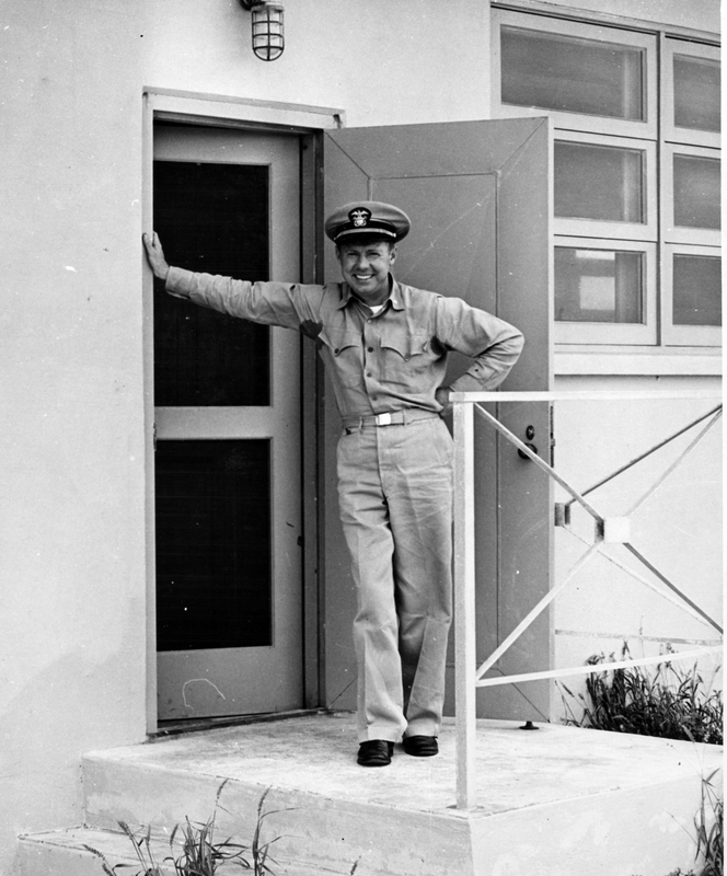 An unidentified officer in the doorway of the building used by ...