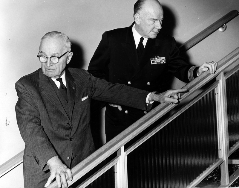 Former President Harry S. Truman and an unidentified Navy officer at ...