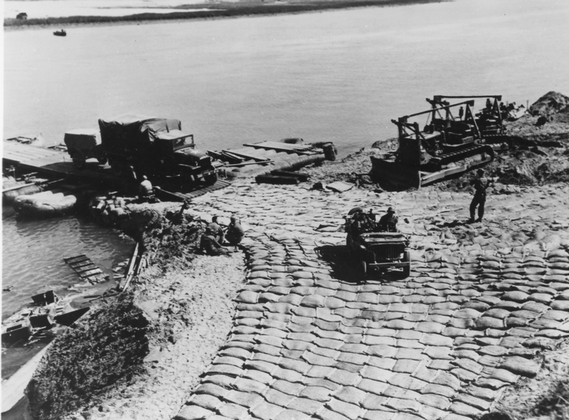 U. N. vehicles cross pontoon bridge near Seoul during the Korean War ...