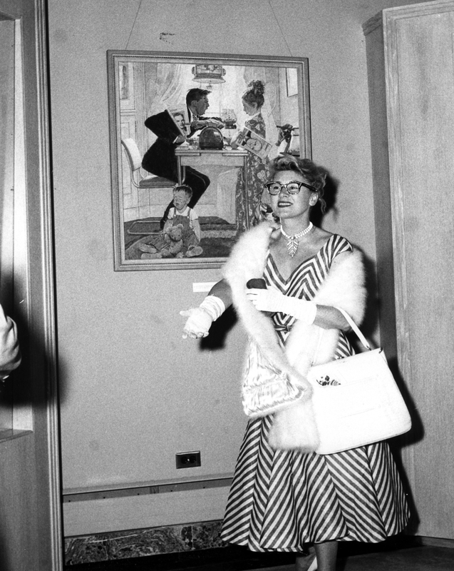 Singer and entertainer Hildegarde poses in front of a Norman Rockwell ...