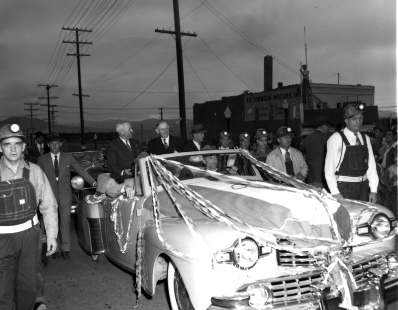 President Truman rides in the back seat of a car in Butte, Montana ...
