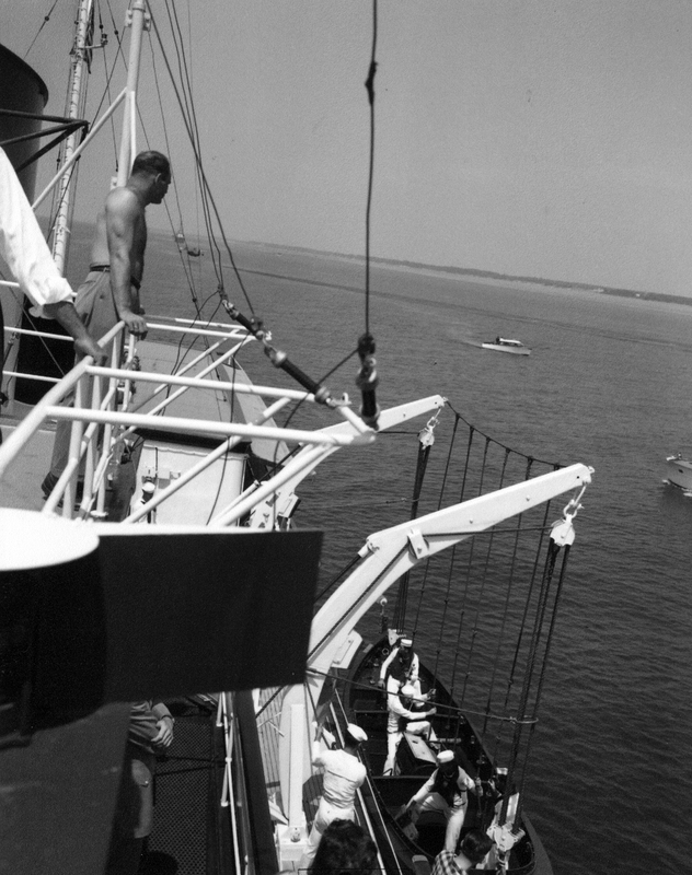 Sailors Aboard the Williamsburg Lower a Motorboat | Harry S. Truman