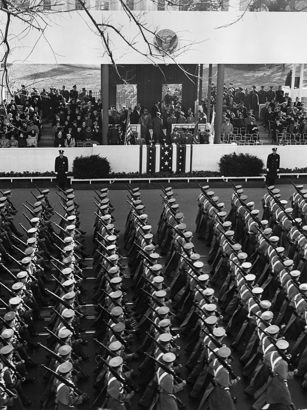 Military Marches Past Presidential Viewing Stand at Inaugural Parade ...