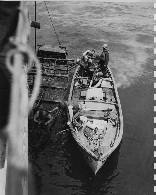 United States Naval Corpsmen Prepare to Lift a Damaged North Korean ...