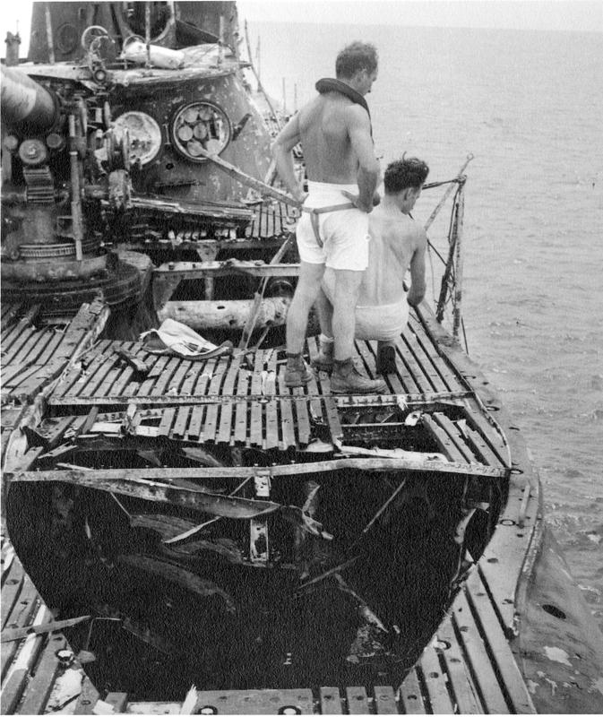 Two Sailors Inspect Damaged Submarine | Harry S. Truman