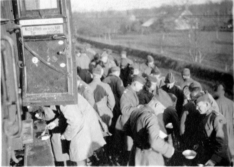 World War I Soldiers Eating a Meal Beside a Parked Train | Harry S. Truman