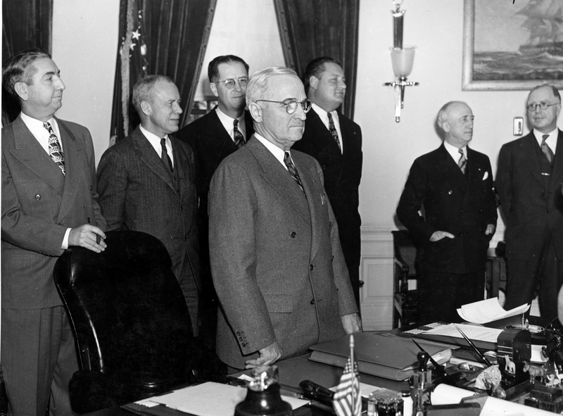 President Truman at his Desk With Others | Harry S. Truman