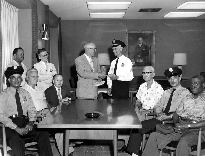 Presentation of booklets by Harry S. Truman to Truman Library staff and ...
