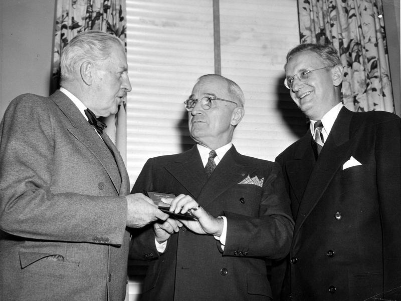 Truman presenting National Press Club member card | Harry S. Truman