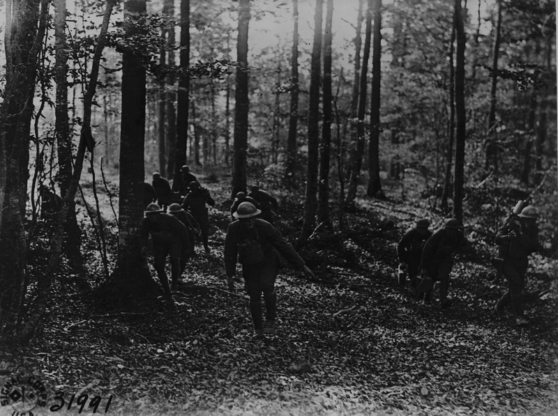 American soldiers advancing through a forest during World War One ...