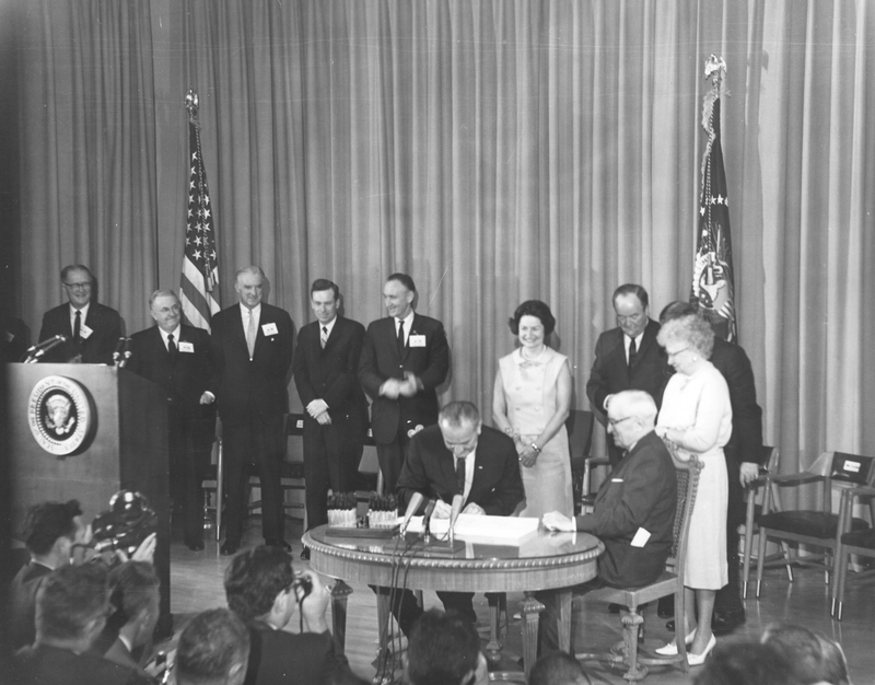President Lyndon B. Johnson signs Medicare bill at the Harry S. Truman ...