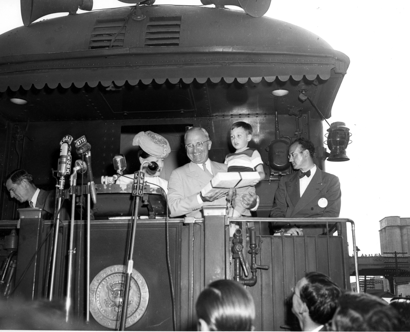 President Truman holding small child on rear train platform | Harry S ...