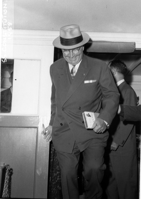 Former President Truman with Hat and Book Aboard the S.S. Constitution ...