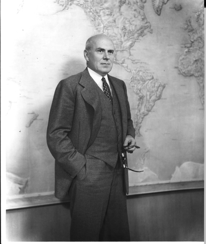 Formal portrait of John J. McCloy in front of a world map | Harry S. Truman