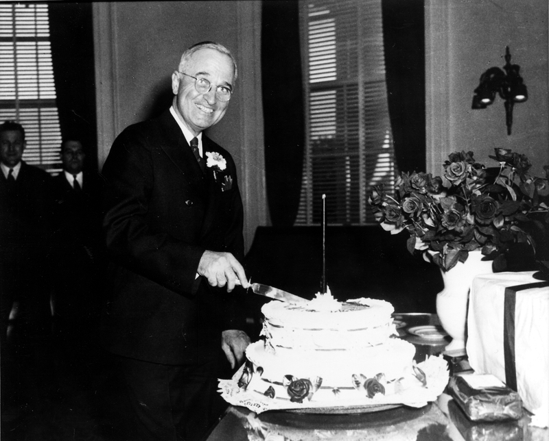 President Truman smiles broadly as he cuts his birthday cake on the ...