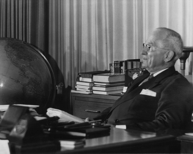 Profile portrait of Truman at desk at the Library | Harry S. Truman