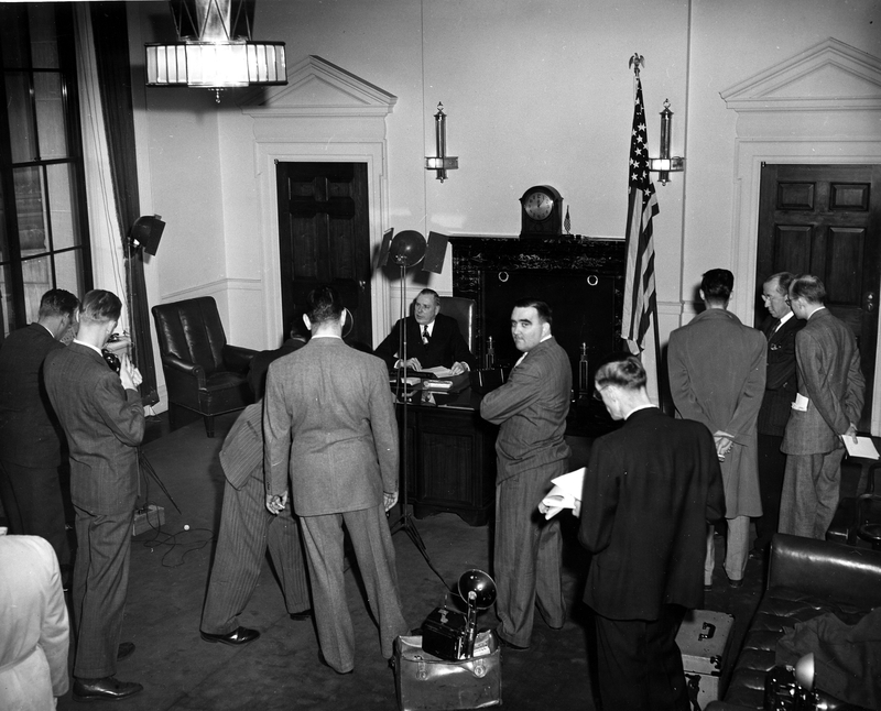 Jesse Donaldson, Postmaster General, appears at his desk before a group ...