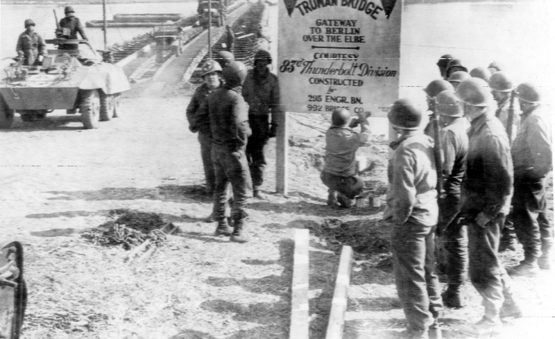 U. S. Army Engineers on the Truman treadway bridge over the Elbe River ...