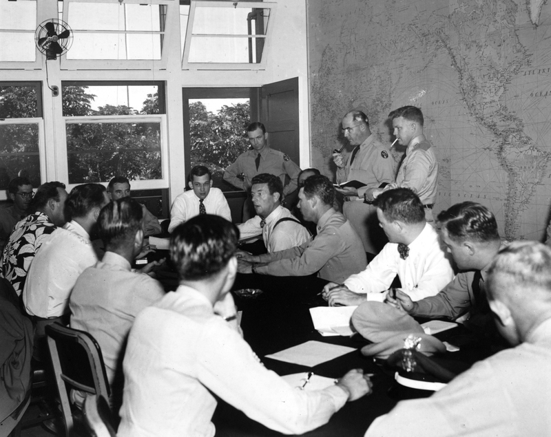 George Elsey and other members of advance party attend a planning ...