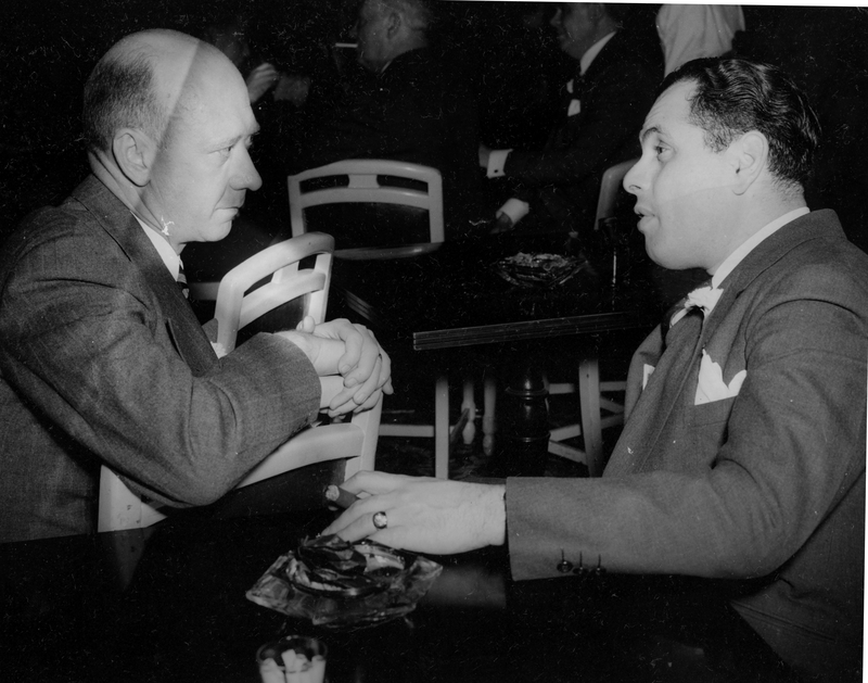Martin Rosenberg and Gil Weiss talking before a dinner in honor of ...