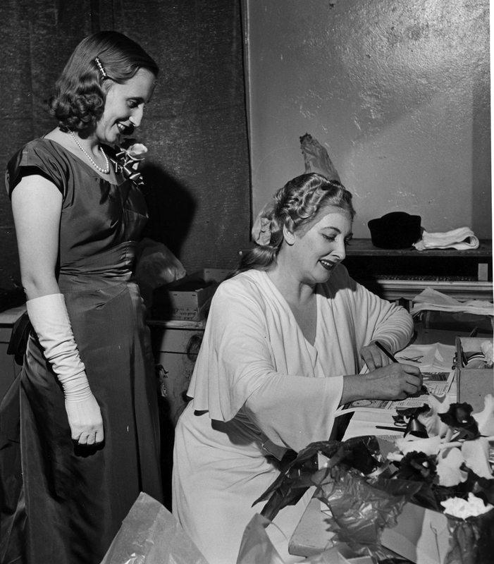Helen Traubel signs Margaret Truman's program at the opening of the ...