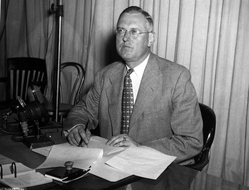 John R. Steelman signing the government wage policy | Harry S. Truman