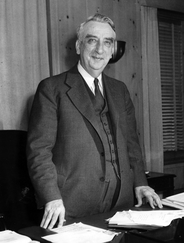 Fred M. Vinson standing at desk | Harry S. Truman