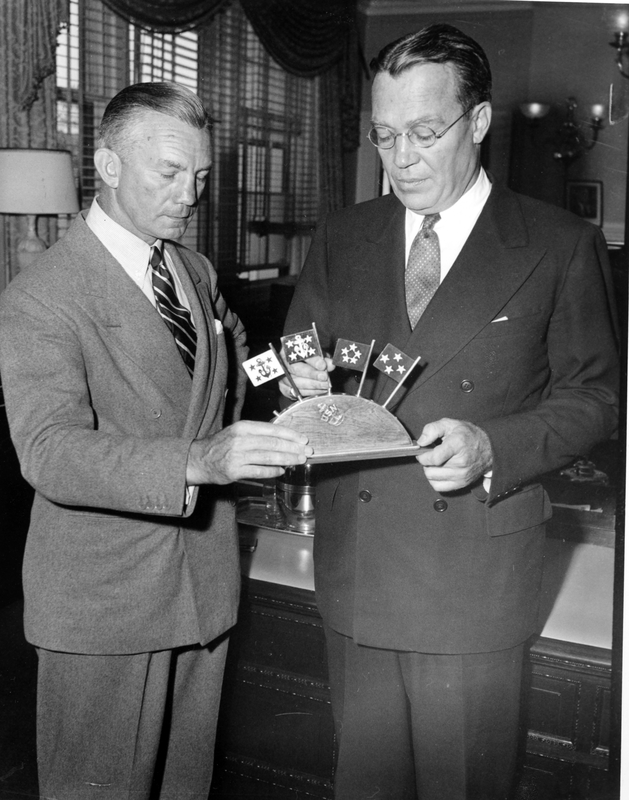 Artemus L. Gates placing his flag in position on Secretary James ...