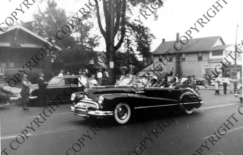 Black and white snapshot of President Harry S. Truman in a motorcade ...