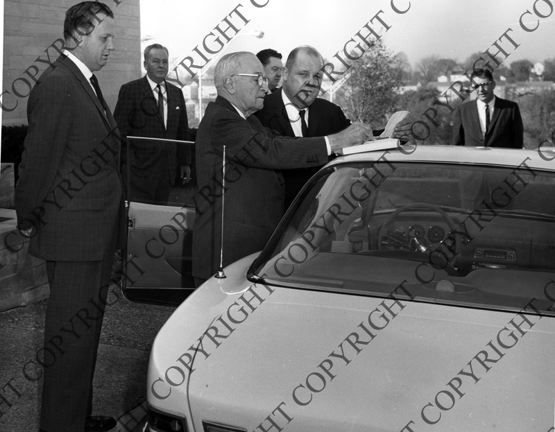 Former President Harry S. Truman autographs a book for Fred D. Whitaker ...
