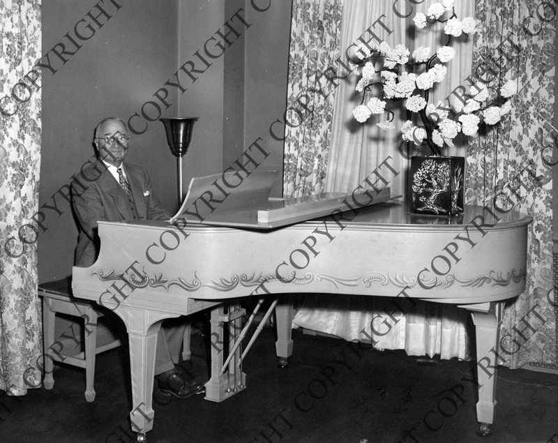 Harry S. Truman playing the piano in the Presidental Penthouse of the ...