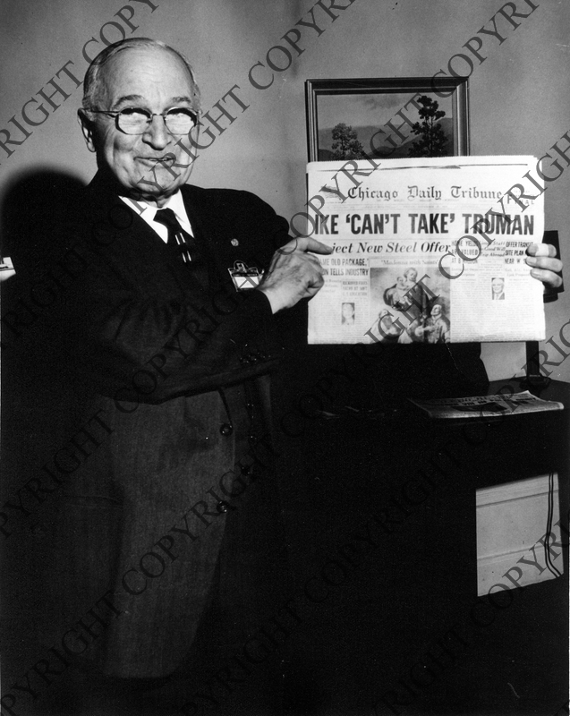 Truman holding newspaper with headline, "Ike 'Can't Take' Truman ...