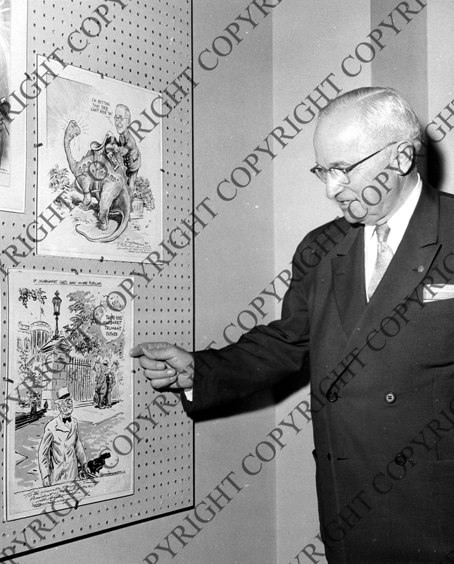Truman looks at political cartoons | Harry S. Truman