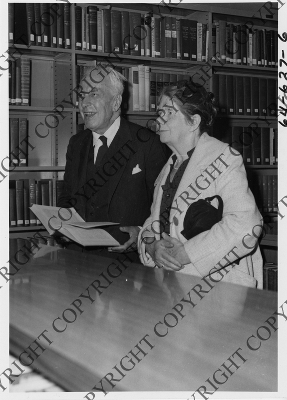 Dr. Arthur Toynbee Holds Open a Book with Mrs. Toynbee | Harry S. Truman