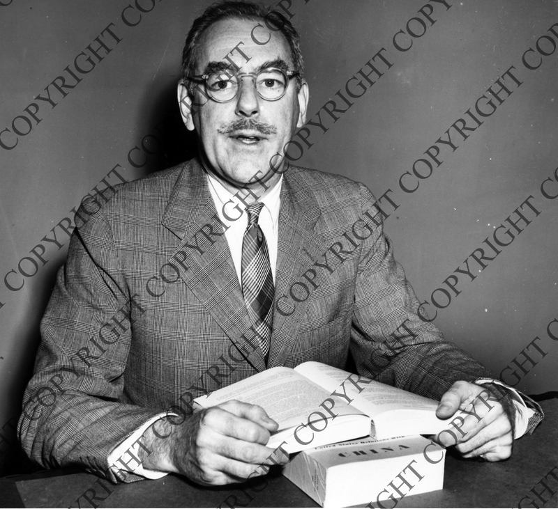 Dean Acheson holds a Copy of the China White Paper | Harry S. Truman