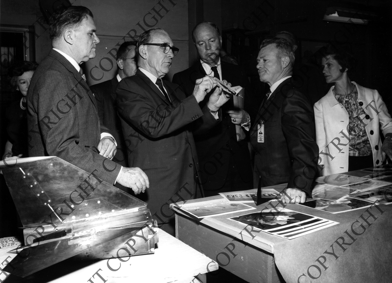 Senator John L. McClellan (Arkansas) center, holds a model plane during ...