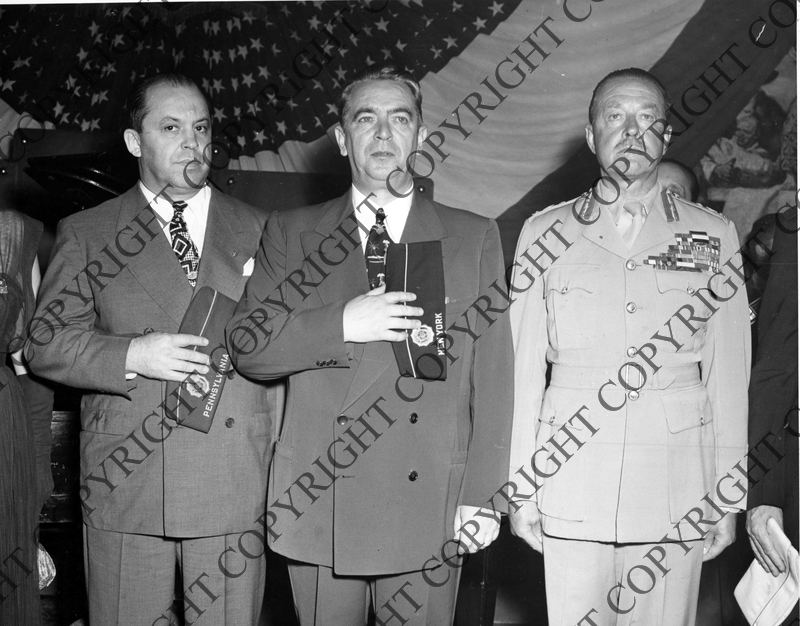 National Commander Paul Griffith (left) shown with two unidentified men ...