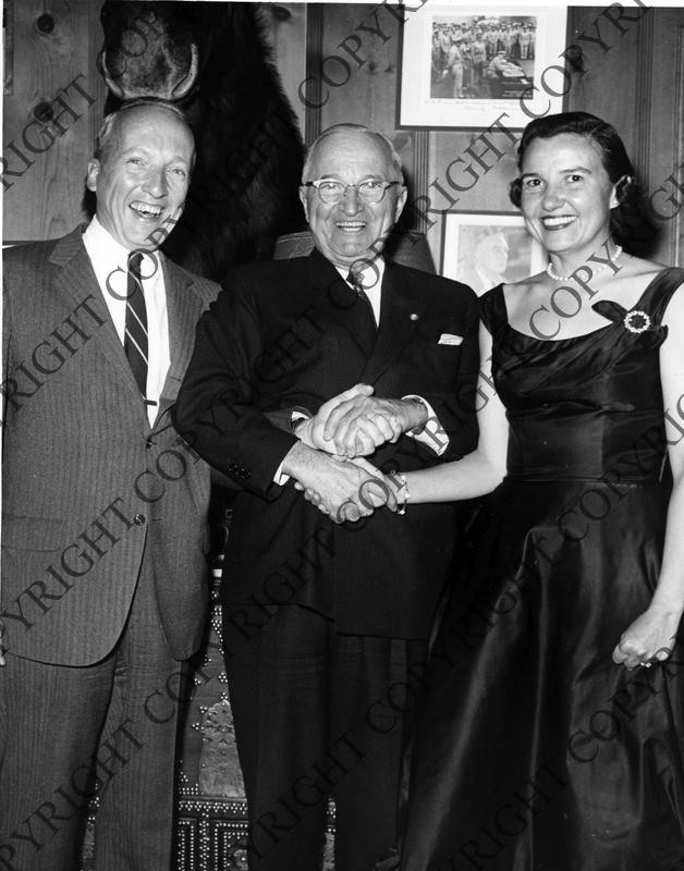 Former President Harry S. Truman engaged in a cross-over handshake with ...