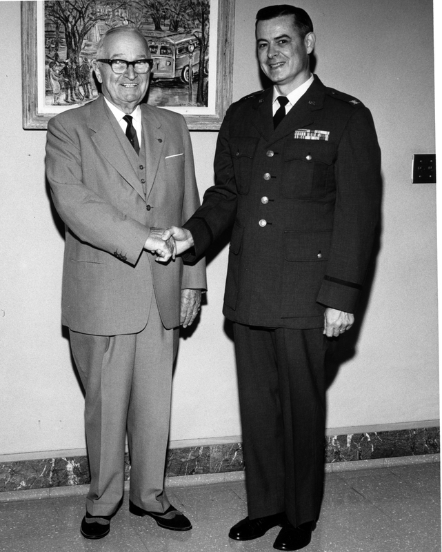 Former President Harry S. Truman and an unidentified military officer ...