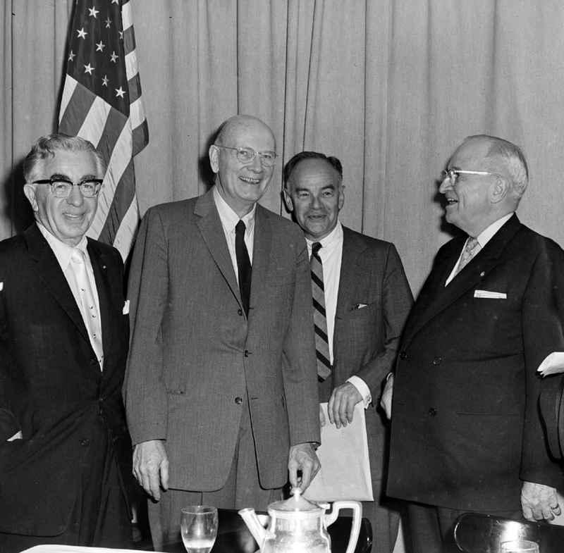 Former President Harry S. Truman at a luncheon with three unidentified ...