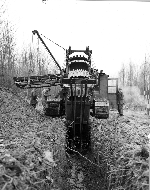 Big ditcher with digging wheel clearing a pipeline ditch | Harry S. Truman