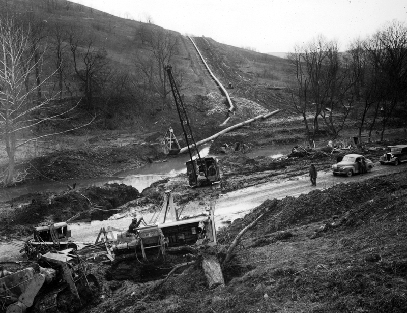 Boom cat towing a clamshell out of mud | Harry S. Truman