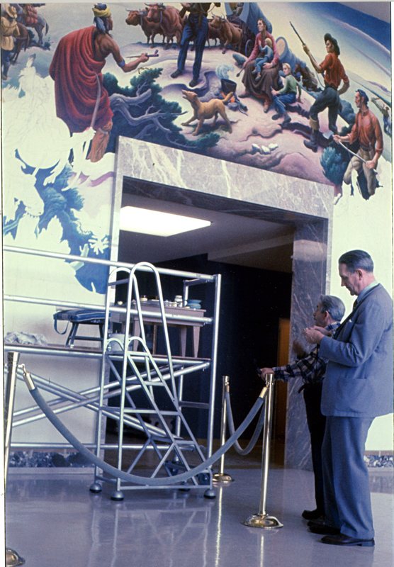 Thomas Hart Benton and an unidentified photographer view the mural at ...