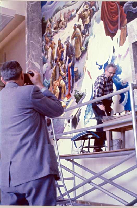 A photographer snaps a picture of Thomas Hart Benton painting on the ...