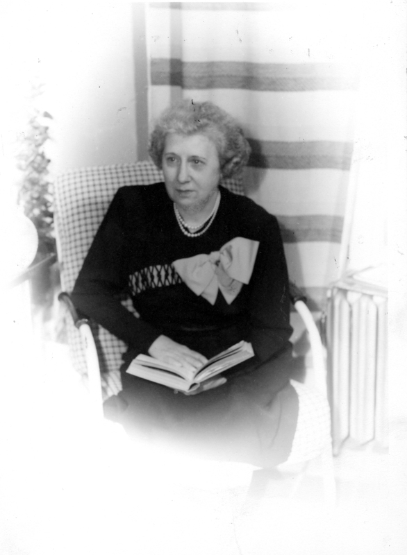 Bess Truman sitting on a chair, holding a book | Harry S. Truman