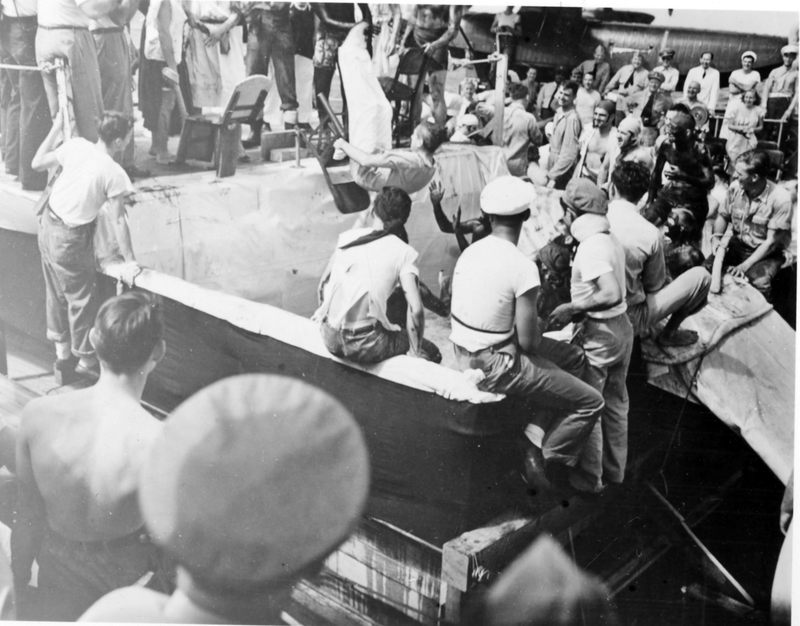 A Pollywog Pitches into the Royal Tank during Shellback Ceremonies ...