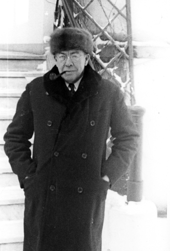 Stanton Griffis standing in the snow smoking a pipe | Harry S. Truman