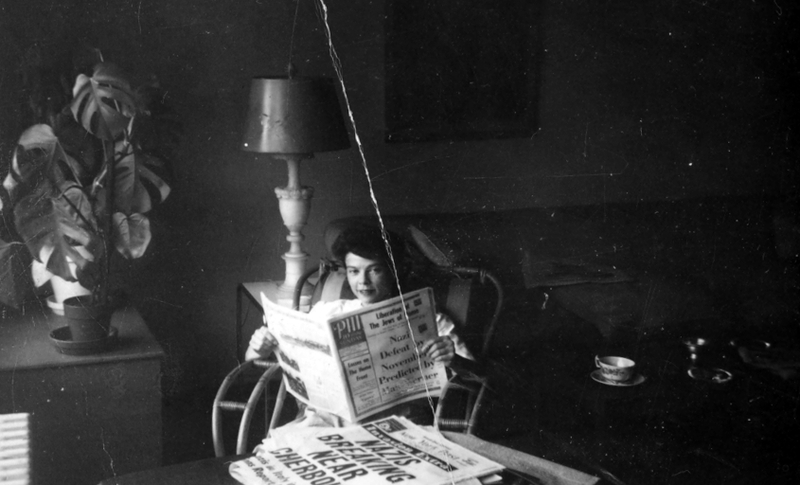 Woman Reading Several World War II Newspapers | Harry S. Truman