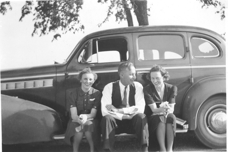 Lyle Watts Sits on the Running Board of a Car Between Ladies | Harry S ...