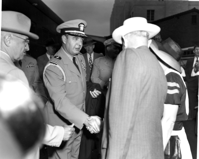 Captain Robert Dennison Shakes Hands with a Man | Harry S. Truman
